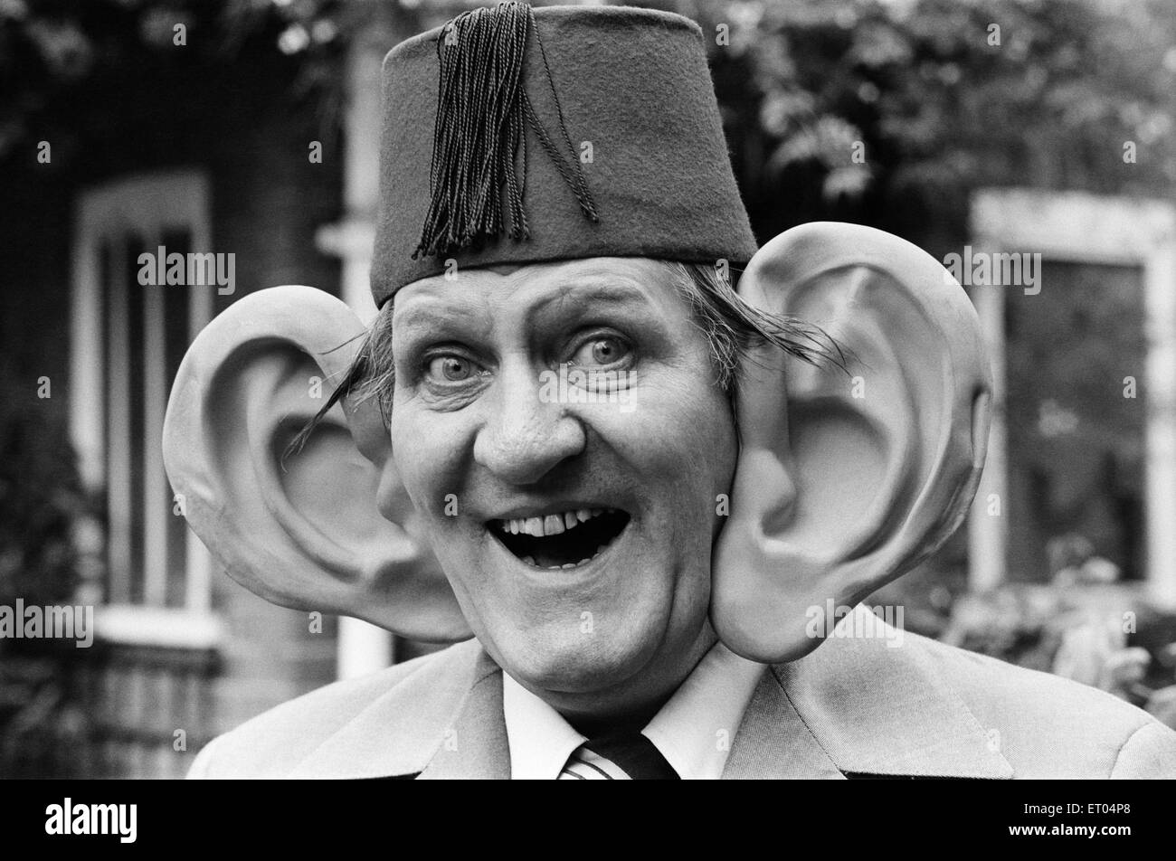 Tommy Cooper, 15th July 1977. Pictured wearing a giant pair of ears ...