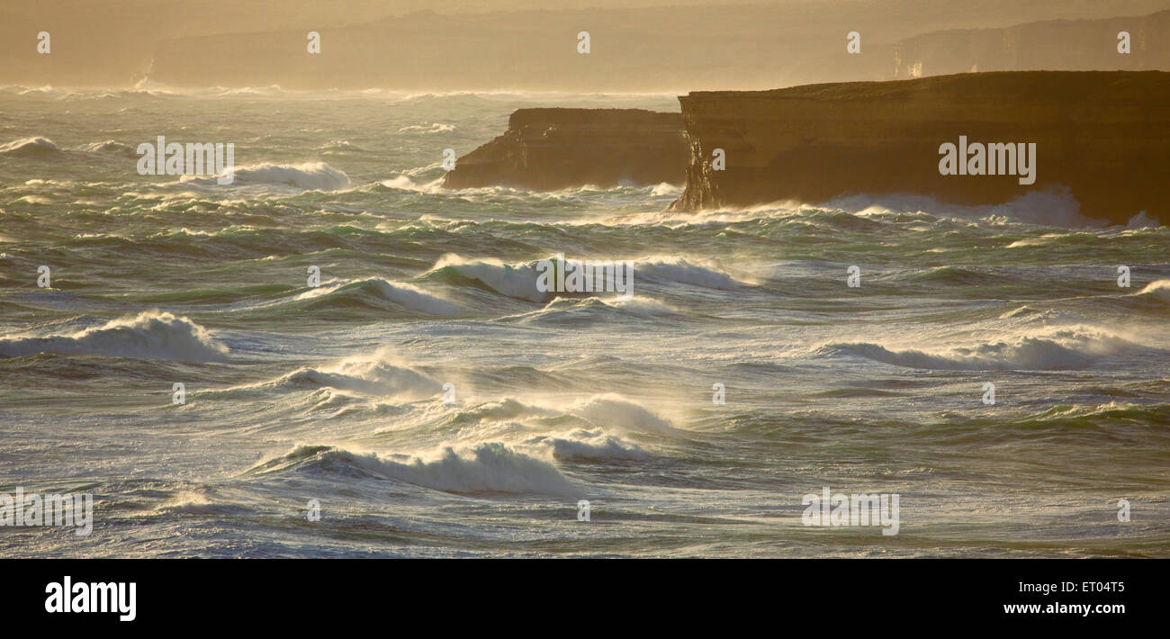 Late afternoon light on rough waves and sea off the Great Ocean Road ...