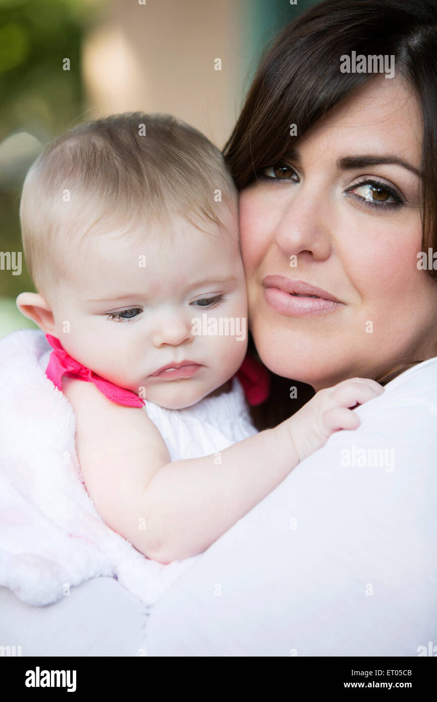 Beautiful woman child in arms hi-res stock photography and images - Alamy