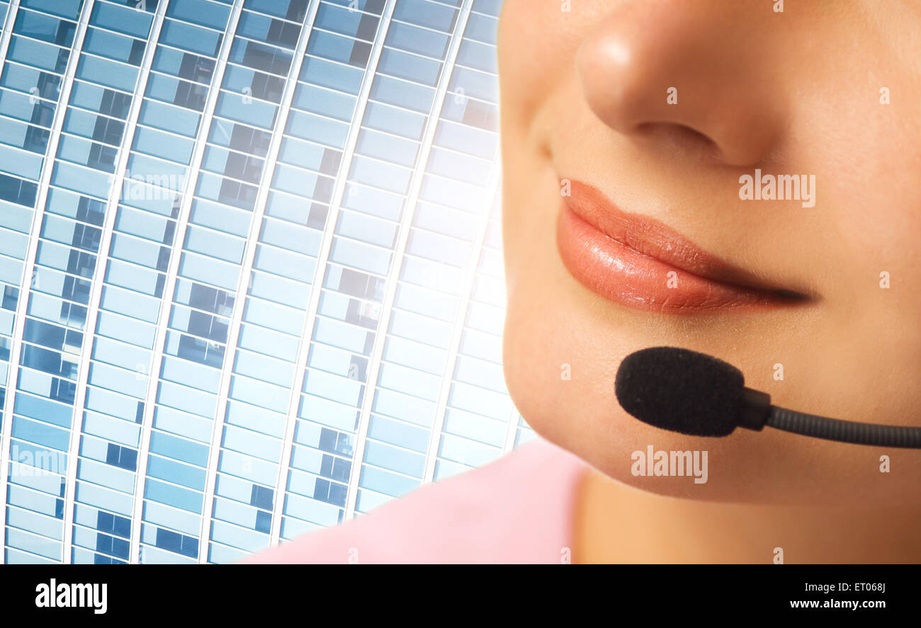 Beautiful hotline operator with headset Stock Photo - Alamy