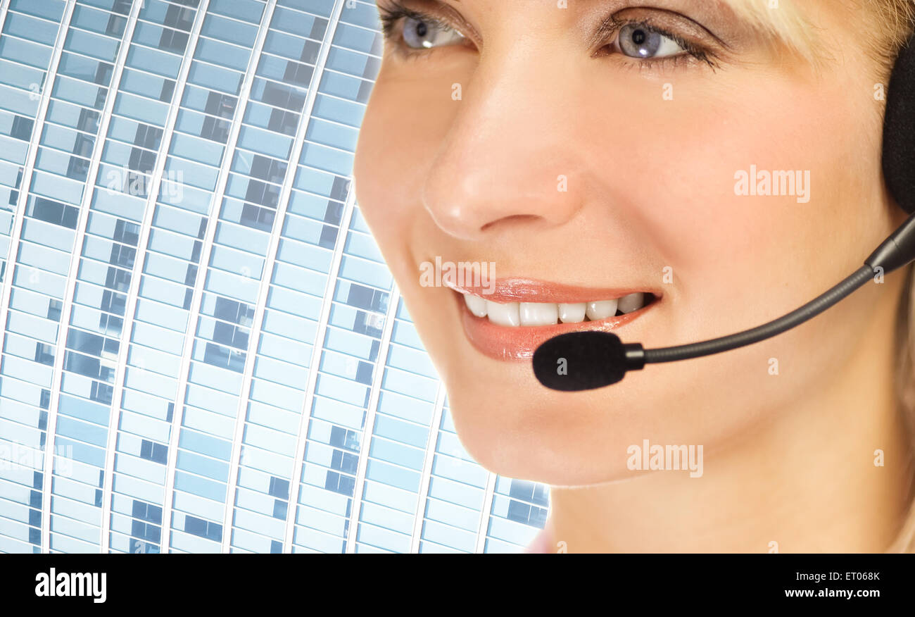 Friendly hotline operator over abstract blue background Stock Photo - Alamy