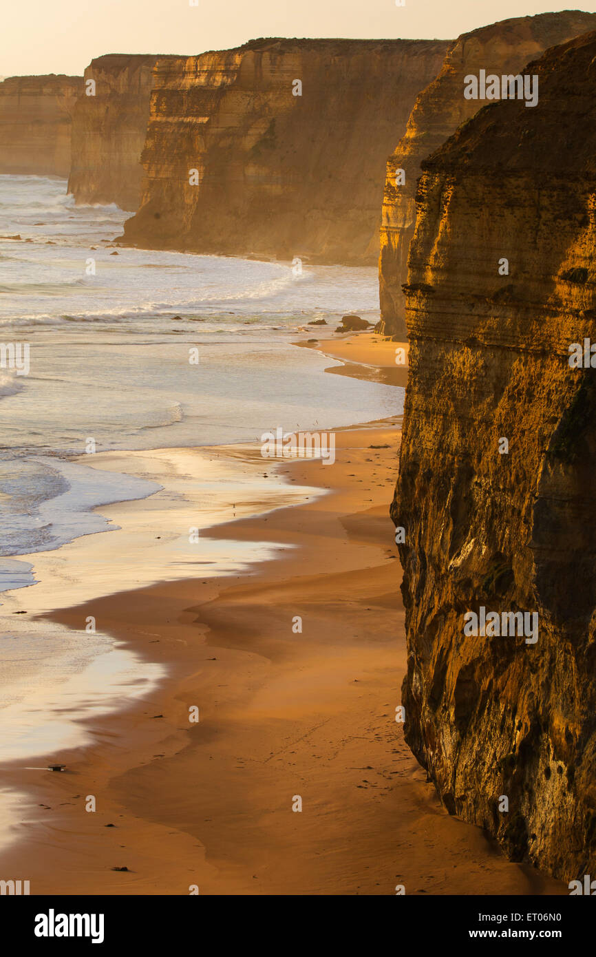 Rugged sandstone cliffs and sandy beach near Port Campbell, Great Ocean ...