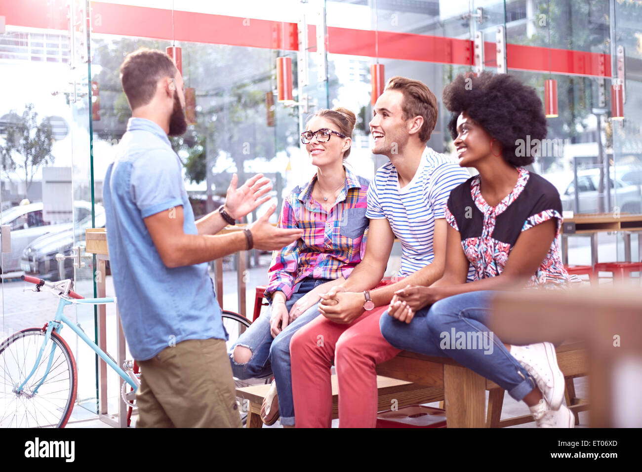 Friends talking and hanging out in cafe Stock Photo - Alamy