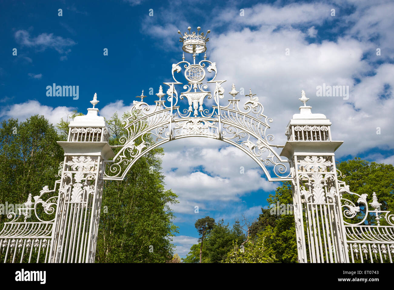White screen gates in spring sunshine at Cholmondeley Castle, Cheshire ...