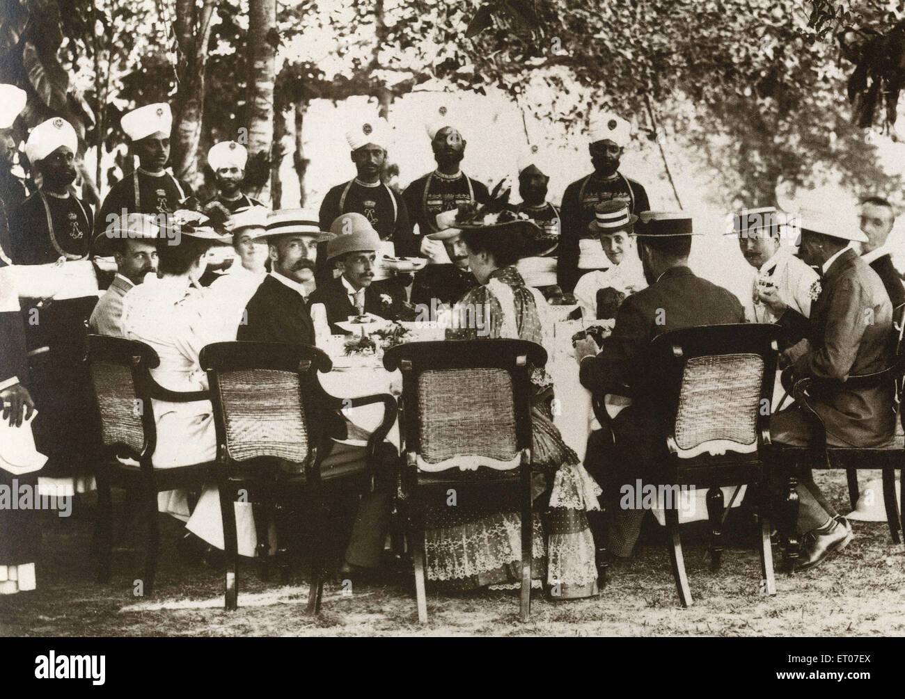 British men and women sitting eating served by Indian men, India, Asia ...