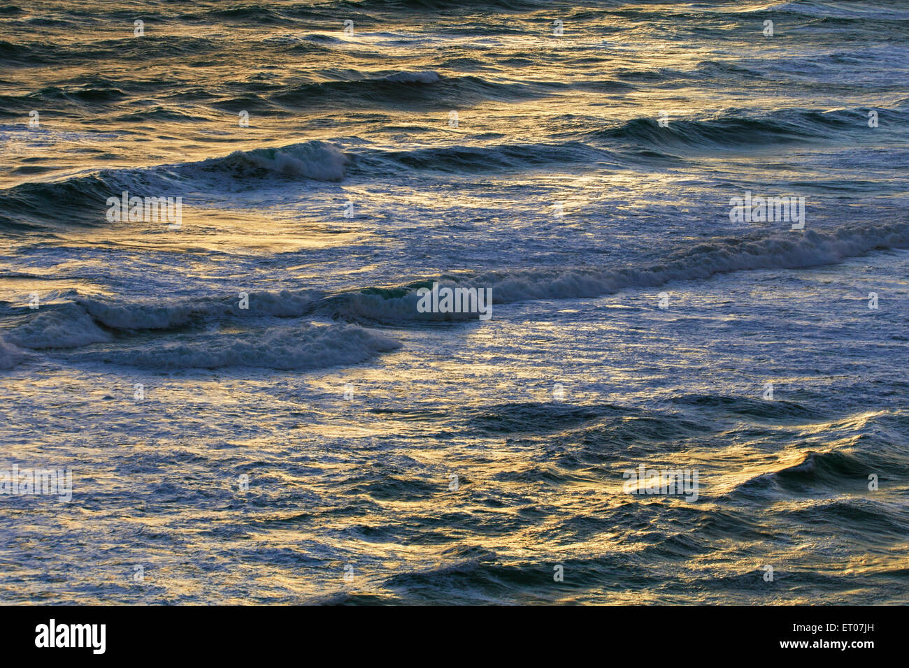 Late afternoon light on rough waves and sea off the Great Ocean Road ...