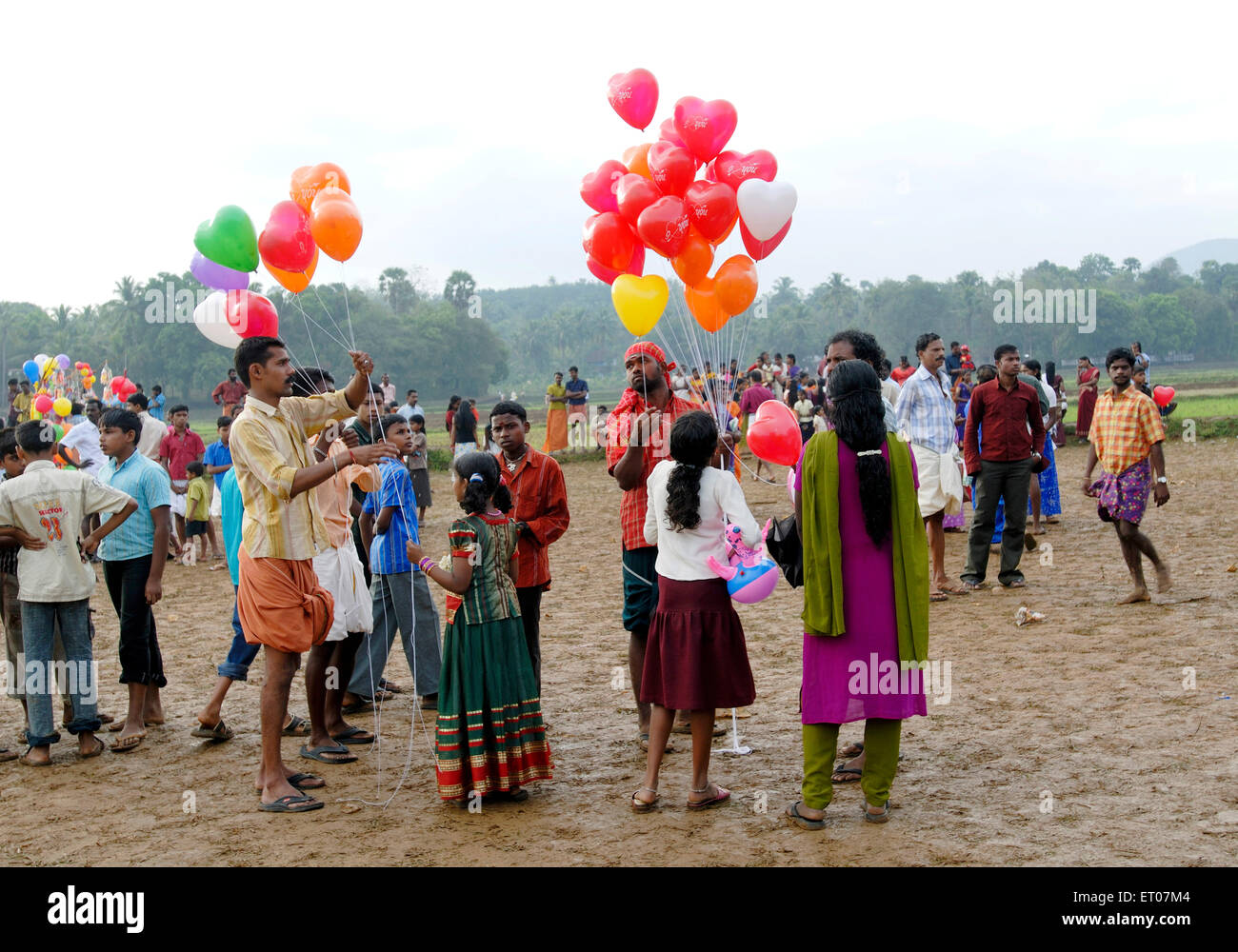People holding balloons and celebrating festival ; kerala ; India Stock ...
