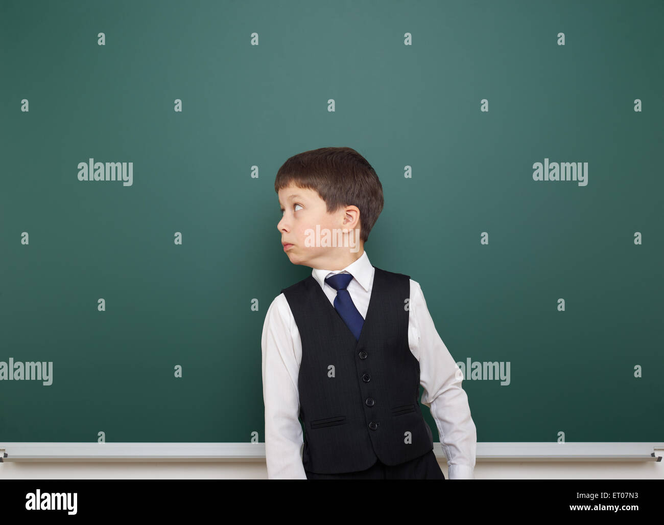 Schoolboy and the school board Stock Photo - Alamy