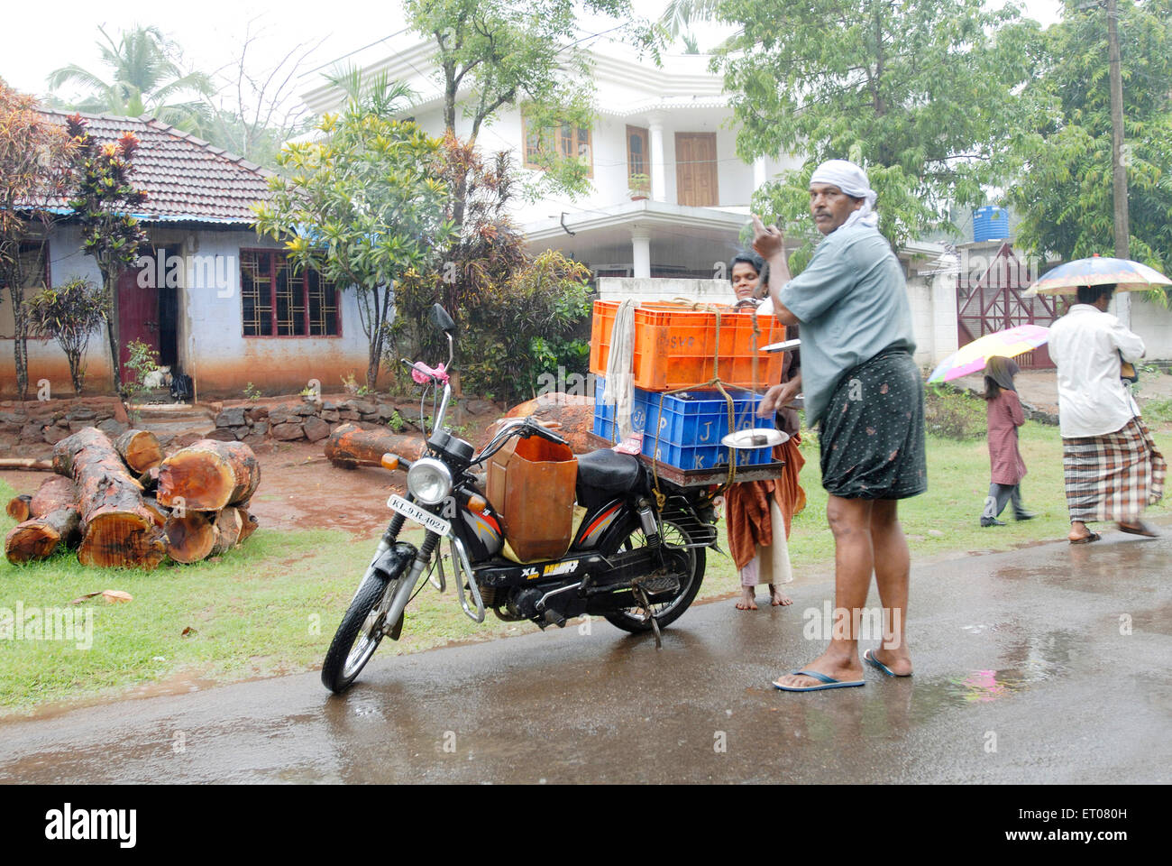Fish seller during a rainy day ; Kerala ; India Stock Photo - Alamy