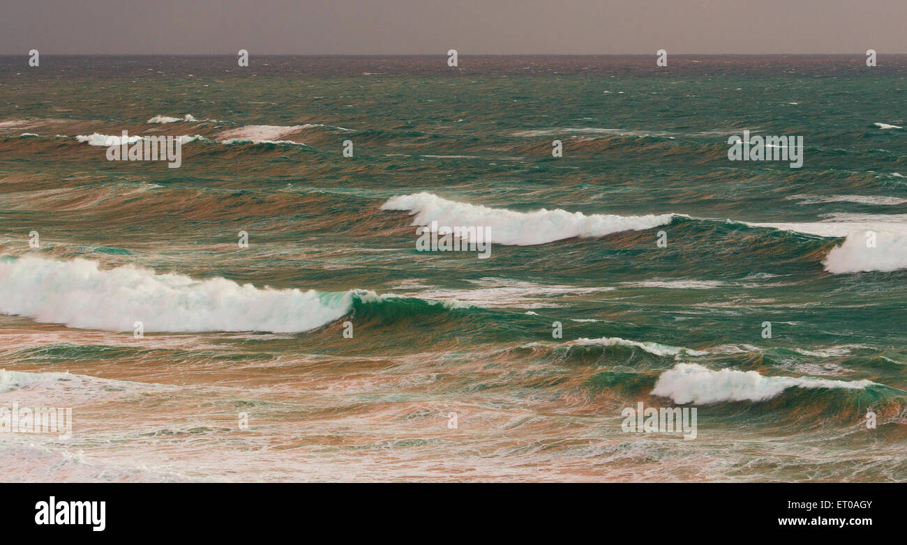 Late afternoon light on rough waves and sea off the Great Ocean Road ...