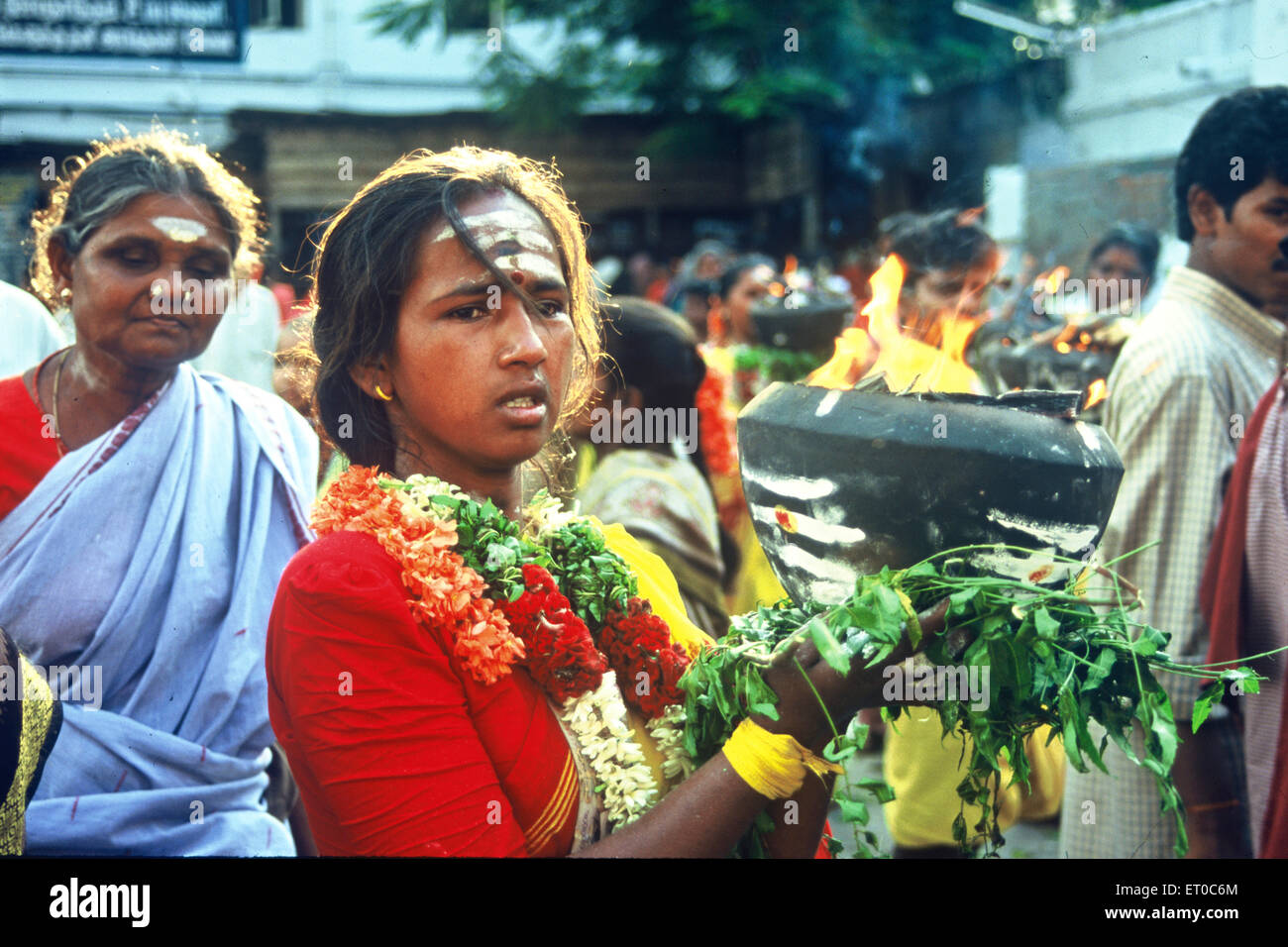 woman devotee holding fire pot, Mariamman festival ; Coimbatore ; Tamil ...
