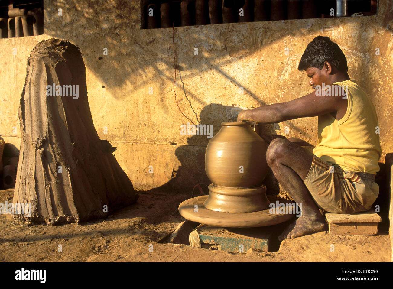 Potter making musical instrument ghatam, Manamadurai ; Madurai , Tamil ...