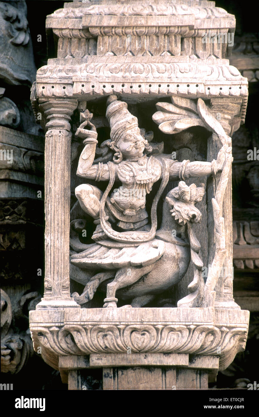 Lord Manmatha wooden carved statue in old temple chariot at Madurai ...