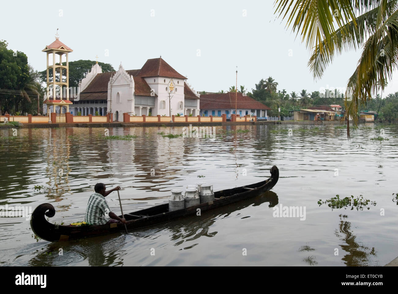 Man in boat with milkcans in pamba river with Champakulam Kalloorkadu ...
