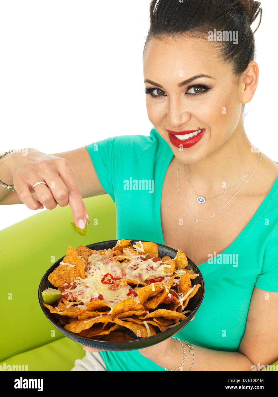 Young Hispanic Woman With A Dish Of Mexican Style Nachos Covered In ...