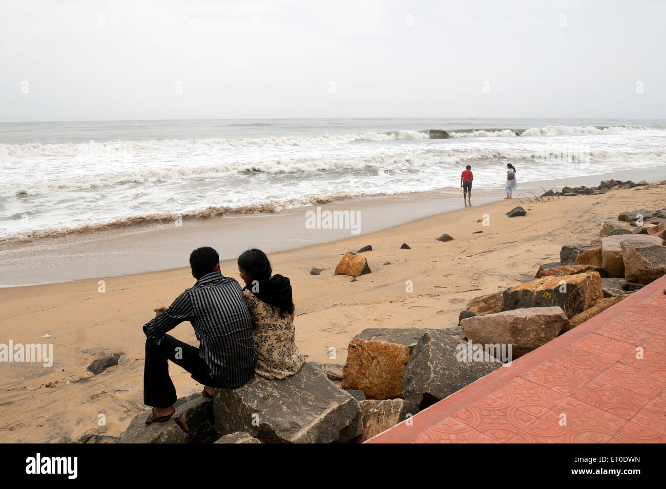 Couple at cherai beach ; Vypin islands ; Cochin Kochi ; Kerala ; India ...