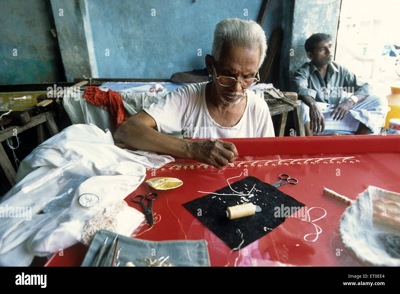 Man doing embroidery work ; Triplicane ; Chennai ; Madras ; Tamil Nadu ...