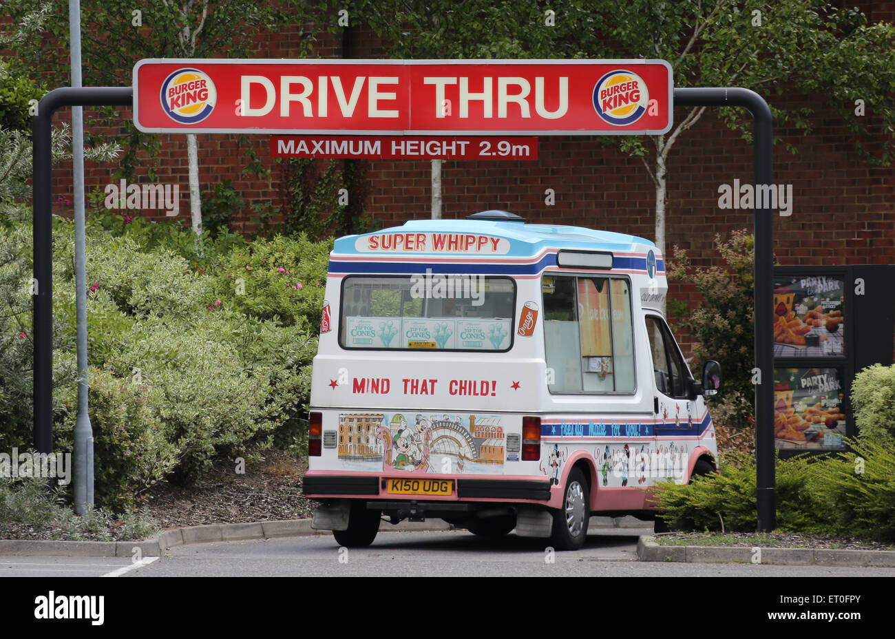 An Ice Cream van drives through a Burger King drive thru at a ...