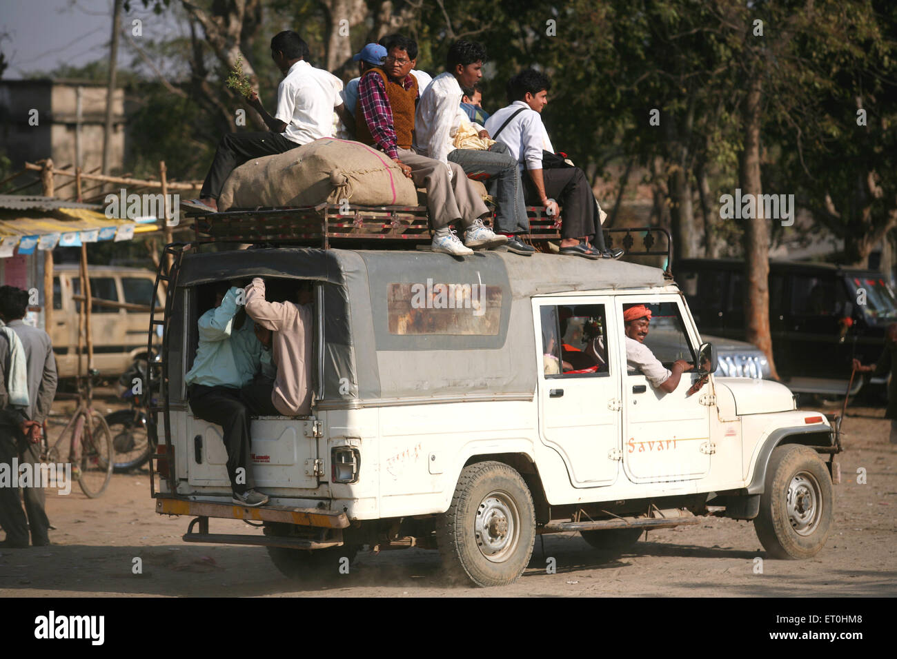 Passengers sitting on top of jeep used as local transport system in ...