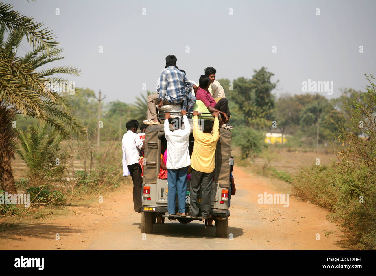 Passengers sitting on top of jeep used as local transport system in ...
