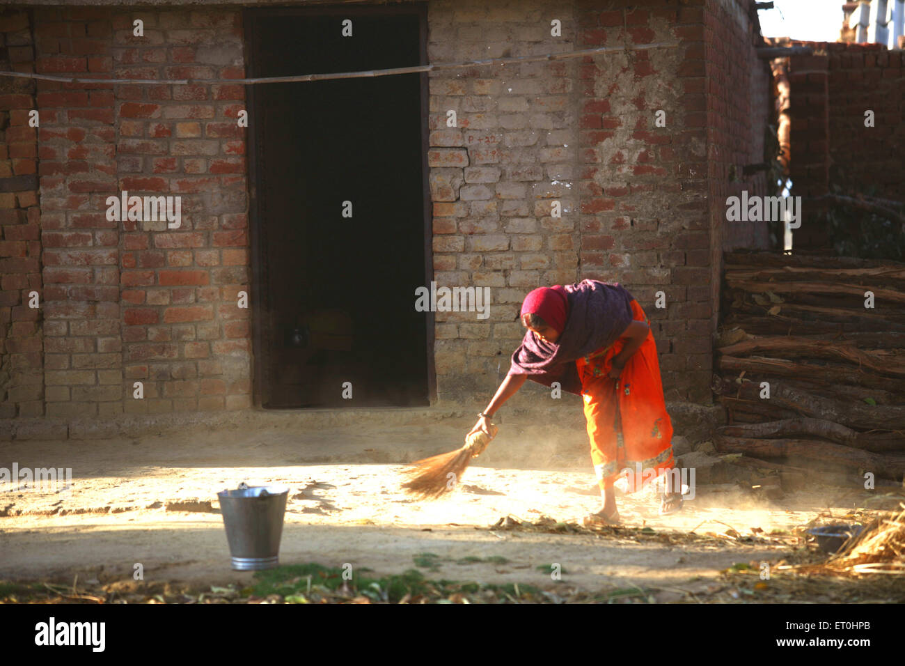Indian woman cleaning outside house hi-res stock photography and images ...