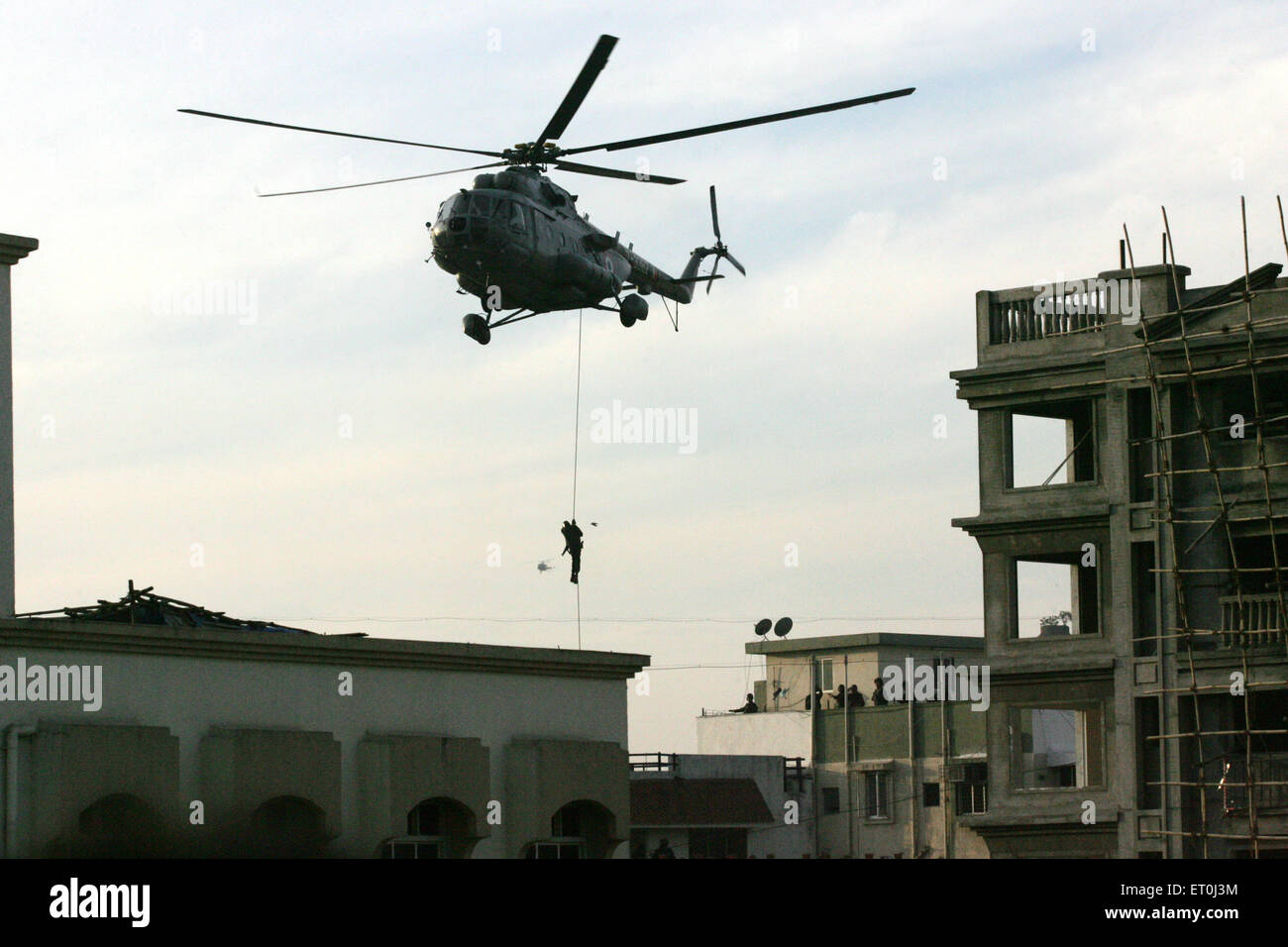 National Security Guard NSG commando getting down helicopter on terrace ...