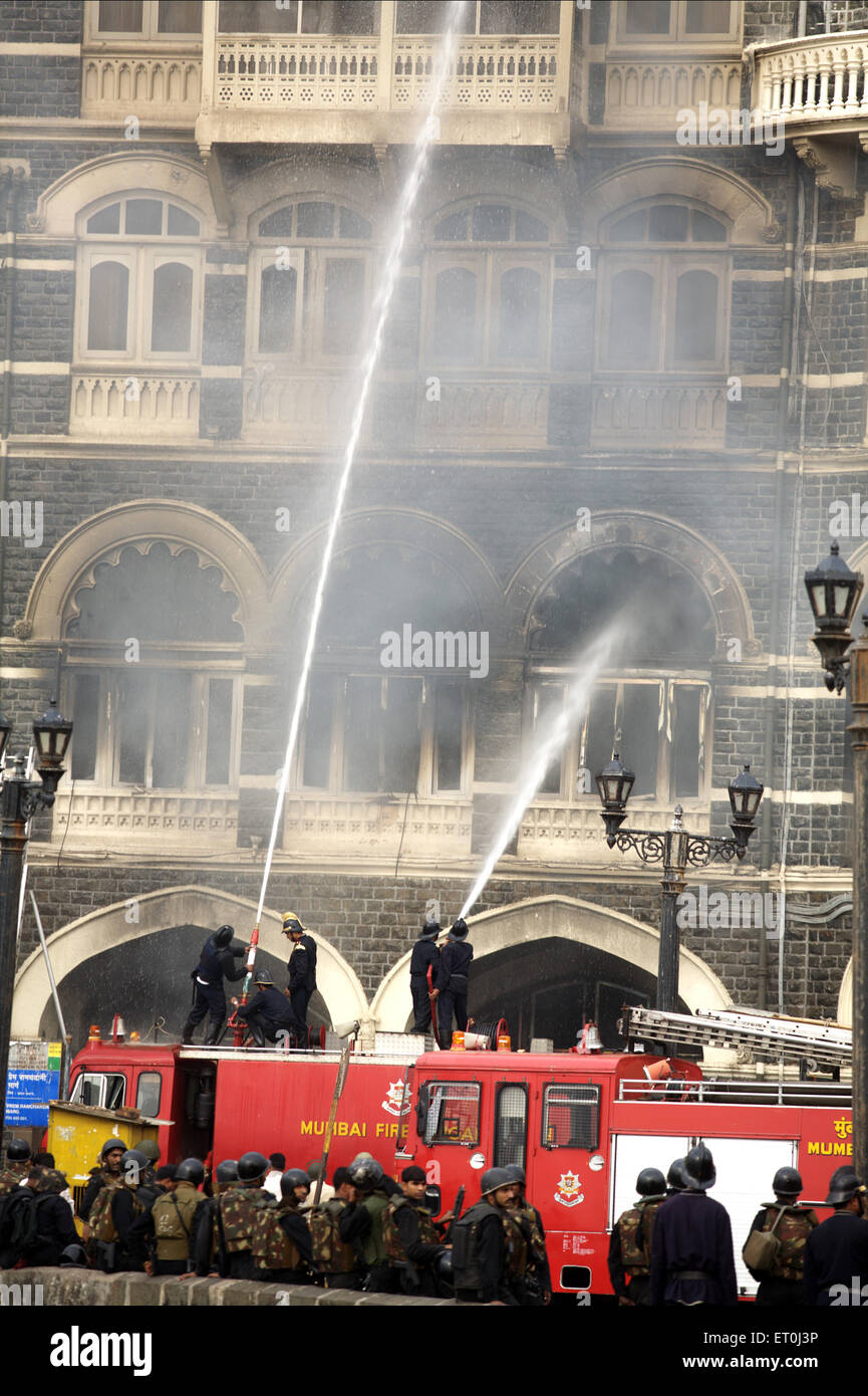 Fire brigade officers putting off fire at Taj Mahal hotel burnt by ...