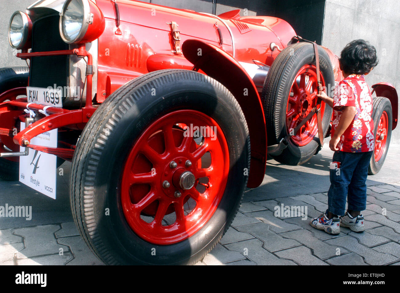 A young admirer of car ; Vintage car rally at Kala Ghoda ; Bombay ...
