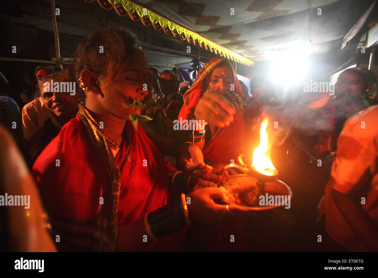 Eunuch followers praying before goddess Yellama ; wedding of eunuchs on ...