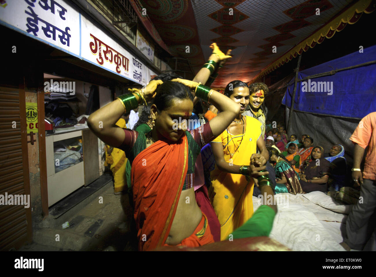 Eunuchs dressed in finery dancing during wedding of eunuchs on occasion ...