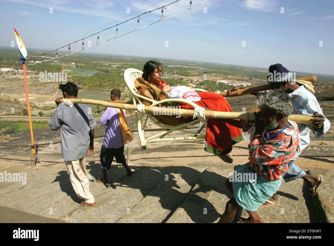 Devotee being carried down hill Mahamasthakabhisheka ; important Jain ...
