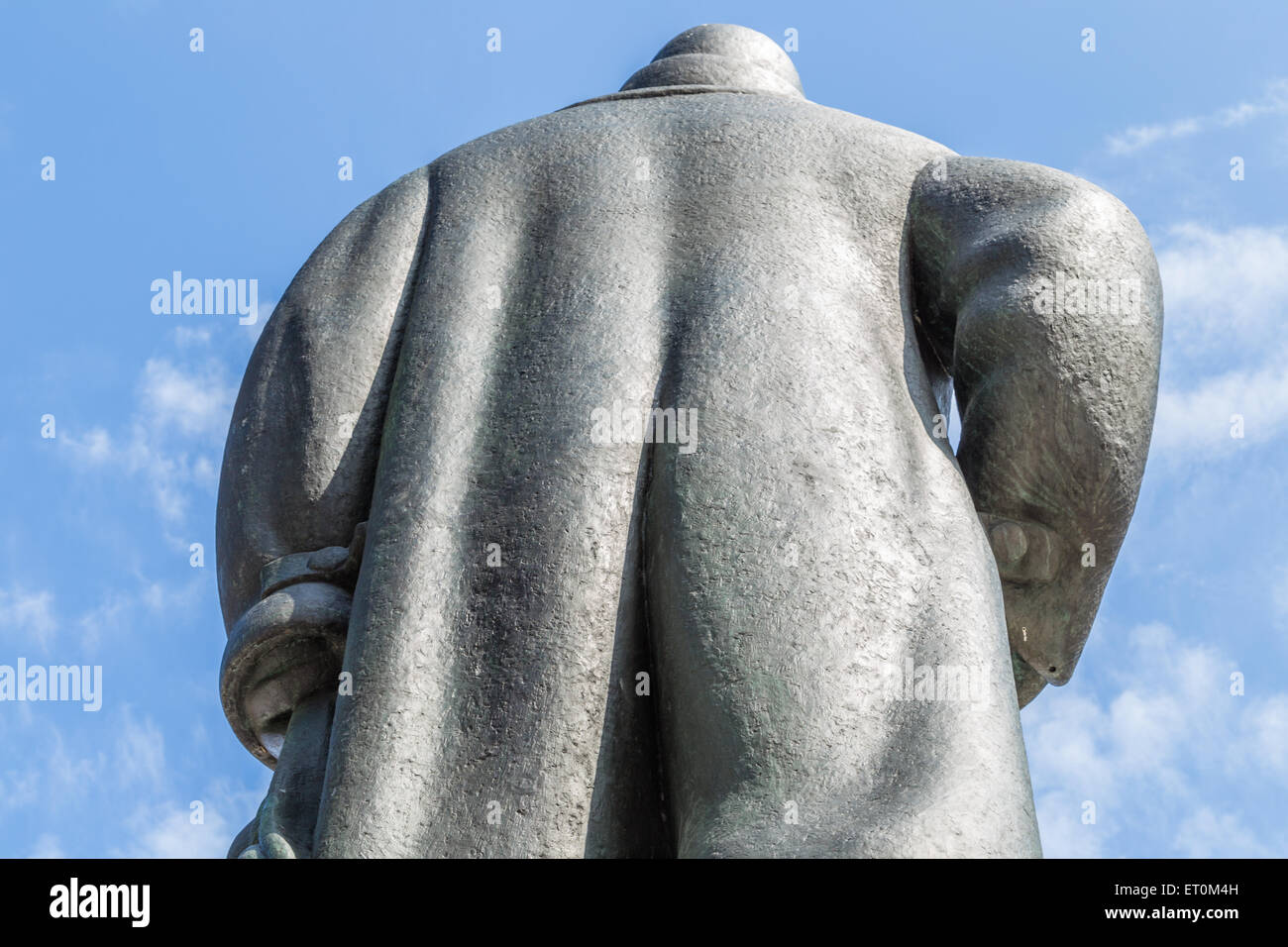 Statue with fat bottom in large trousers on sky background Stock Photo ...