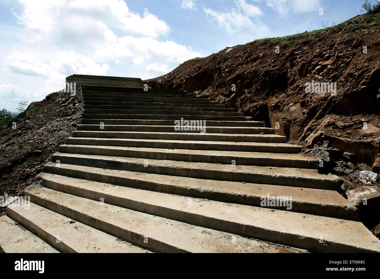 Stairs with beautiful scenic view leading to huge statue of lord ...
