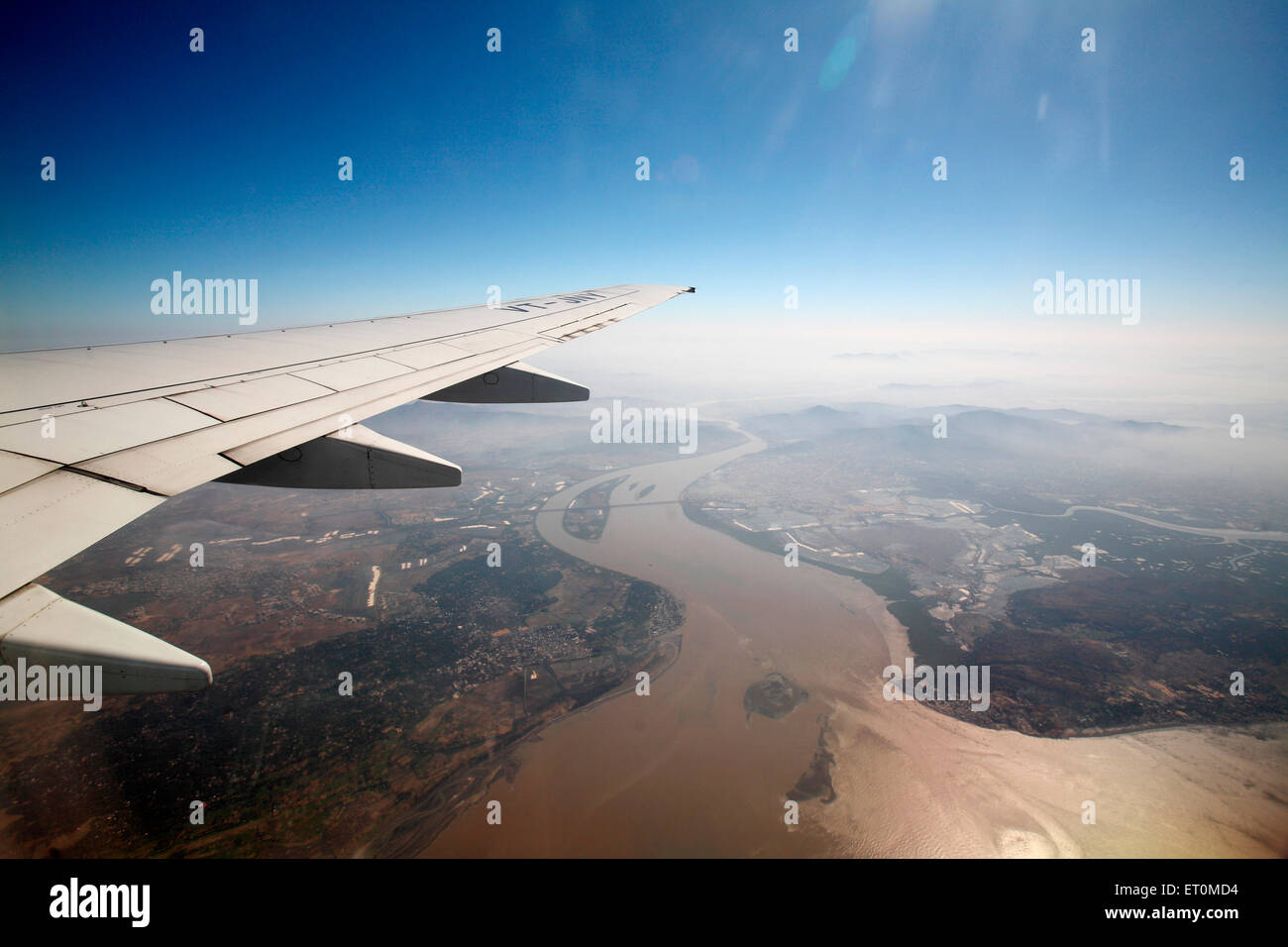 airplane wing, aeroplane wing, aircraft wing, flying over city ...