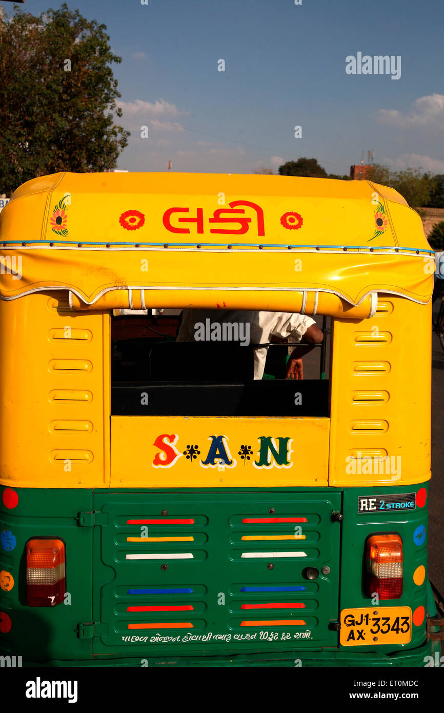 auto rickshaw painted yellow green, Ahmedabad, Gujarat, India Stock ...