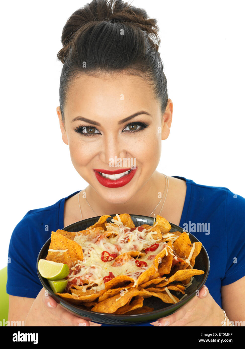 Young Hispanic Woman With A Dish Of Mexican Style Nachos Covered In ...