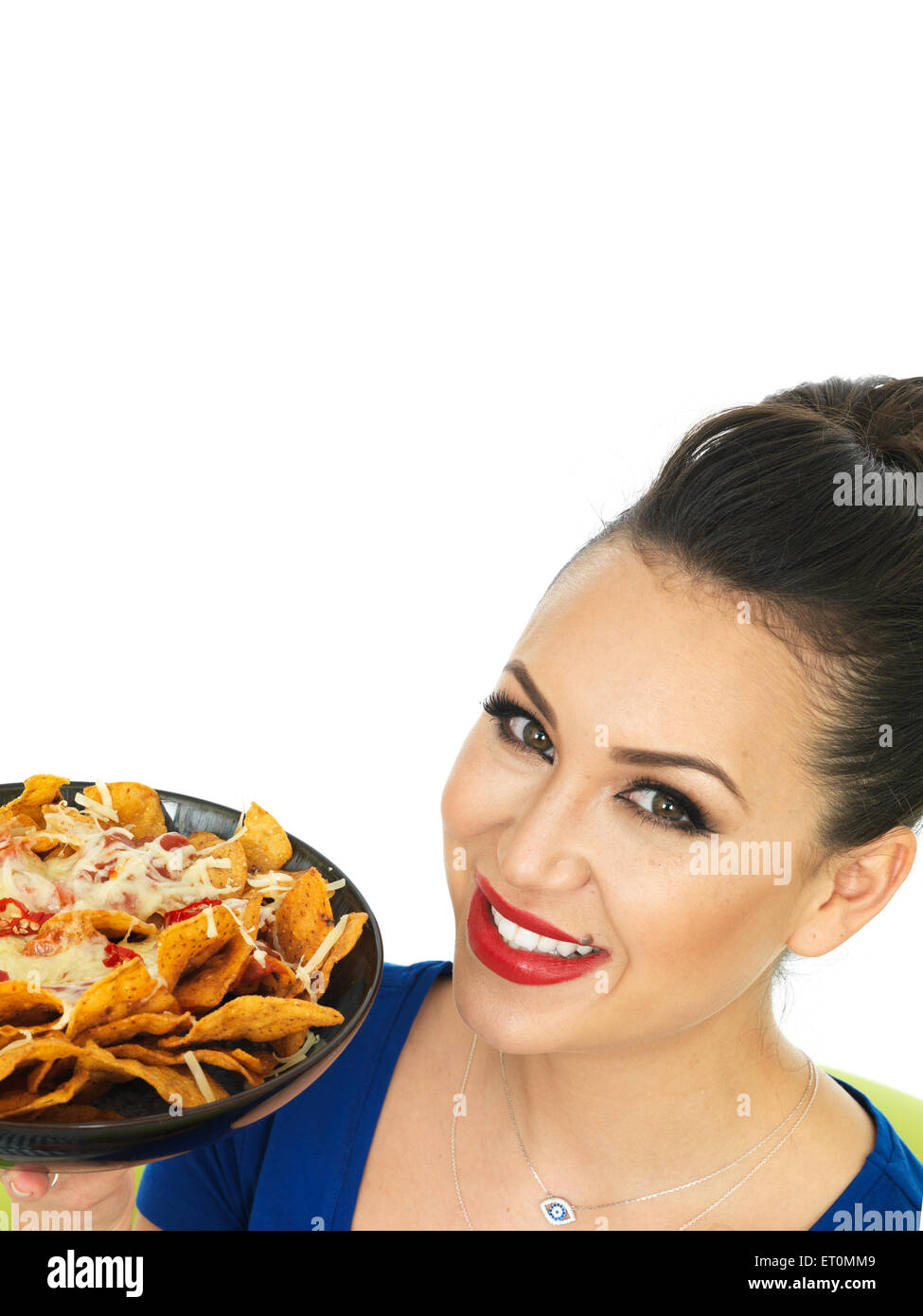 Young Hispanic Woman With A Dish Of Mexican Style Nachos Covered In ...