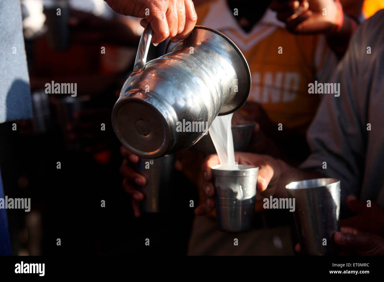 Karsevak distributing bhang or thandai to devotees during celebrations ...