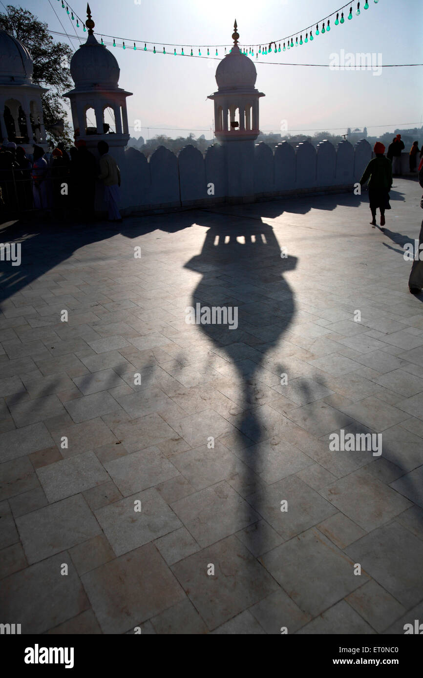 Shadows of devotees and Anandpur sahib Gurudwara in Rupnagar district ...