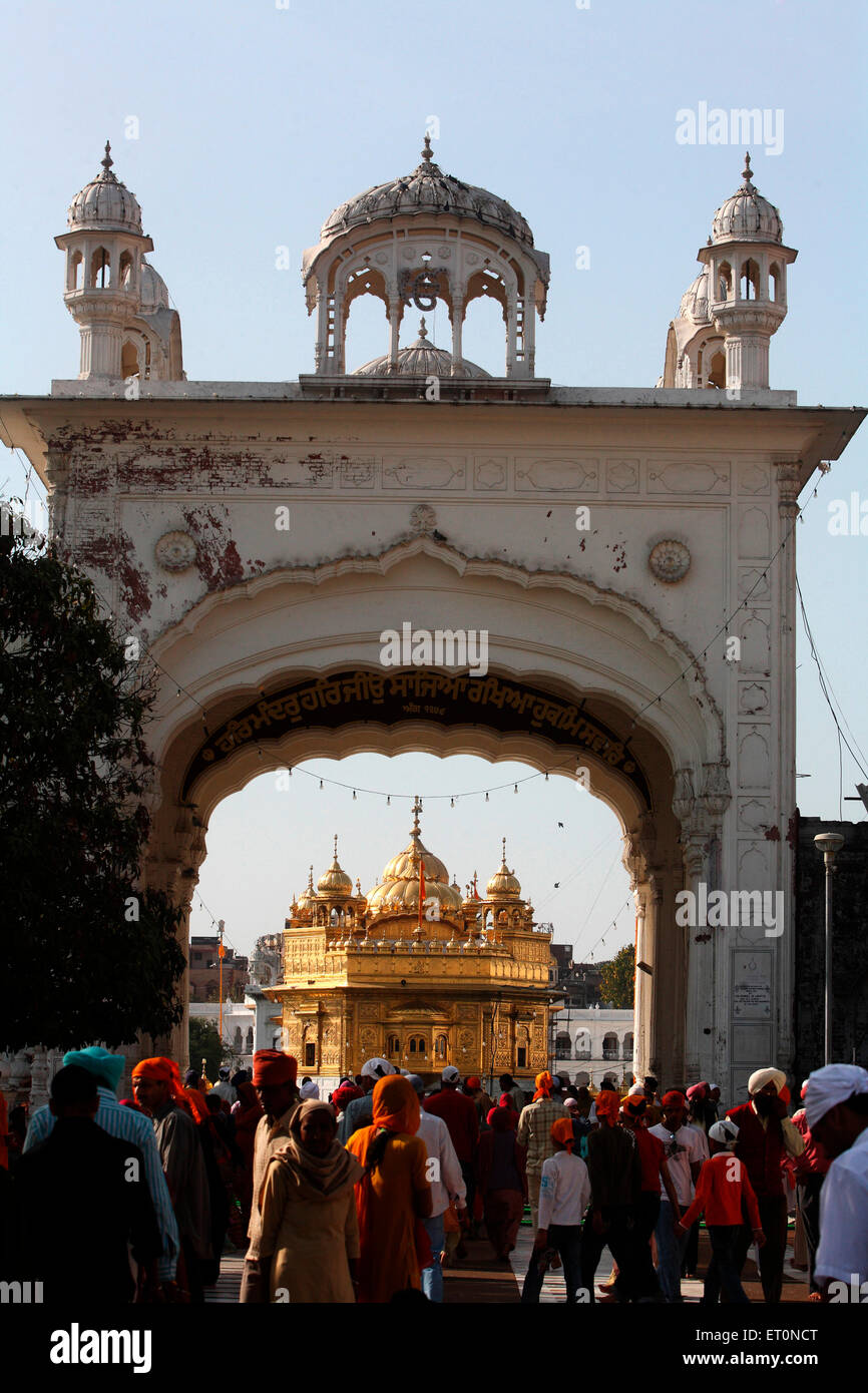 Devotees at entrance gate near Ath sath Tirath to Harmandir Sahib or ...