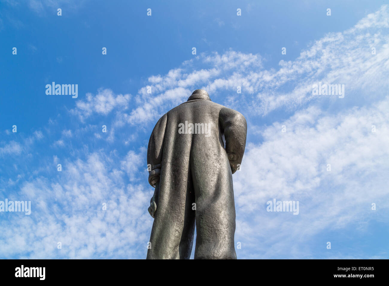 Statue with fat bottom in large trousers on sky background Stock Photo ...