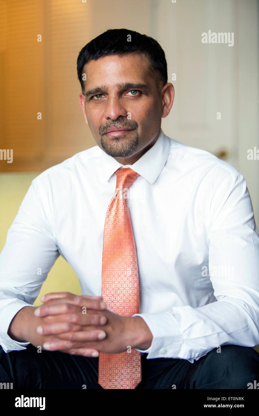 Pakistani man sitting hi-res stock photography and images - Alamy