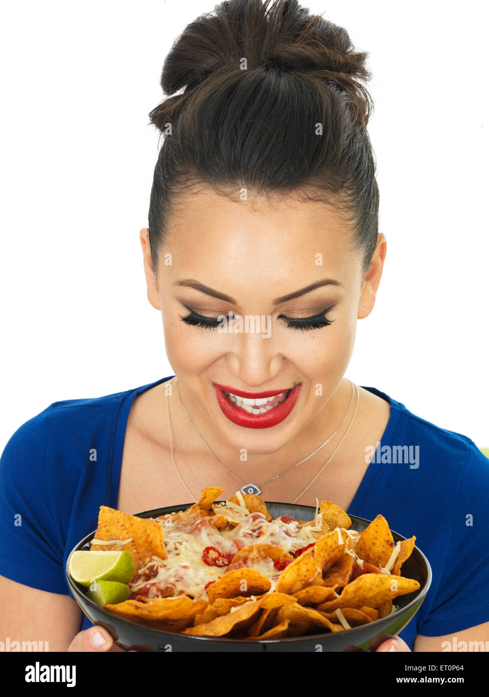 Young Hispanic Woman With A Dish Of Mexican Style Nachos Covered In ...