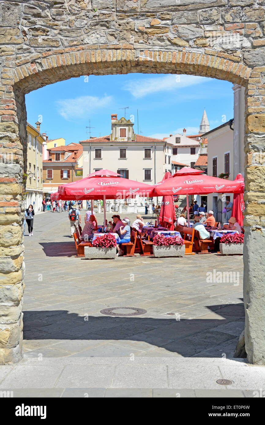 Koper Slovenia Preseren Square entrance archway with tourists and ...
