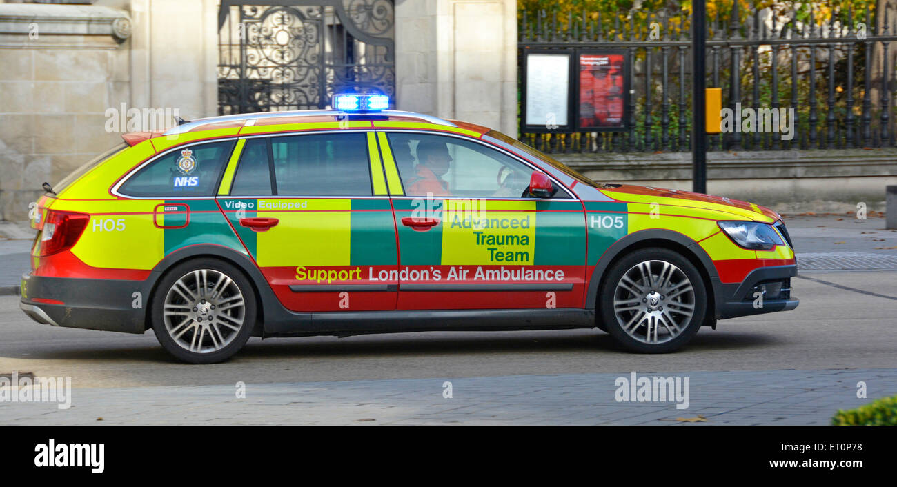Advanced Trauma Paramedic Team in NHS emergency car speeding to a 999 ...