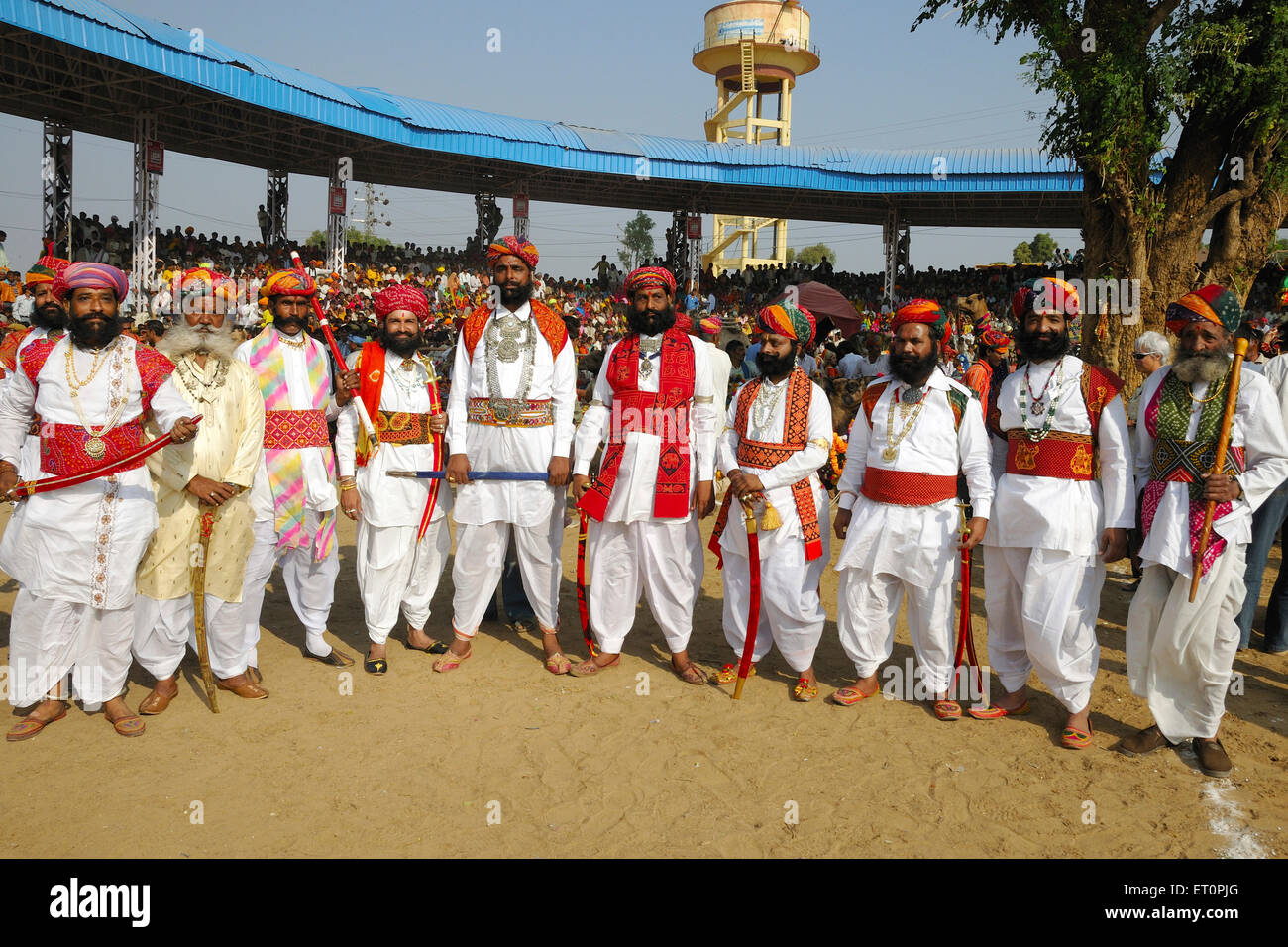 Men in traditional rajasthani costume ; Pushkar fair ; Rajasthan ...