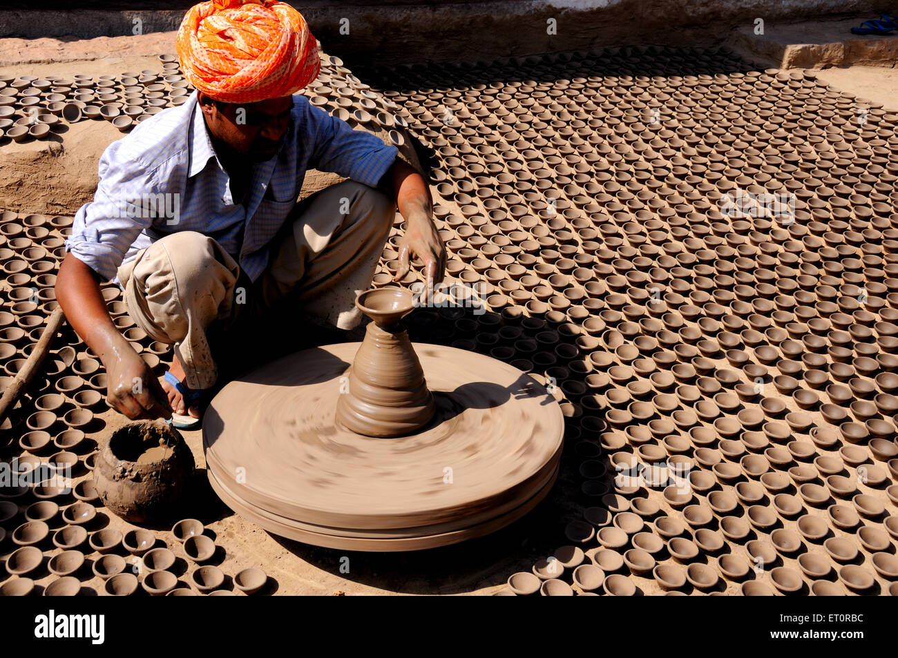 Potter making sand lamps on a potter wheel ; Jodhpur ; Rajasthan ...