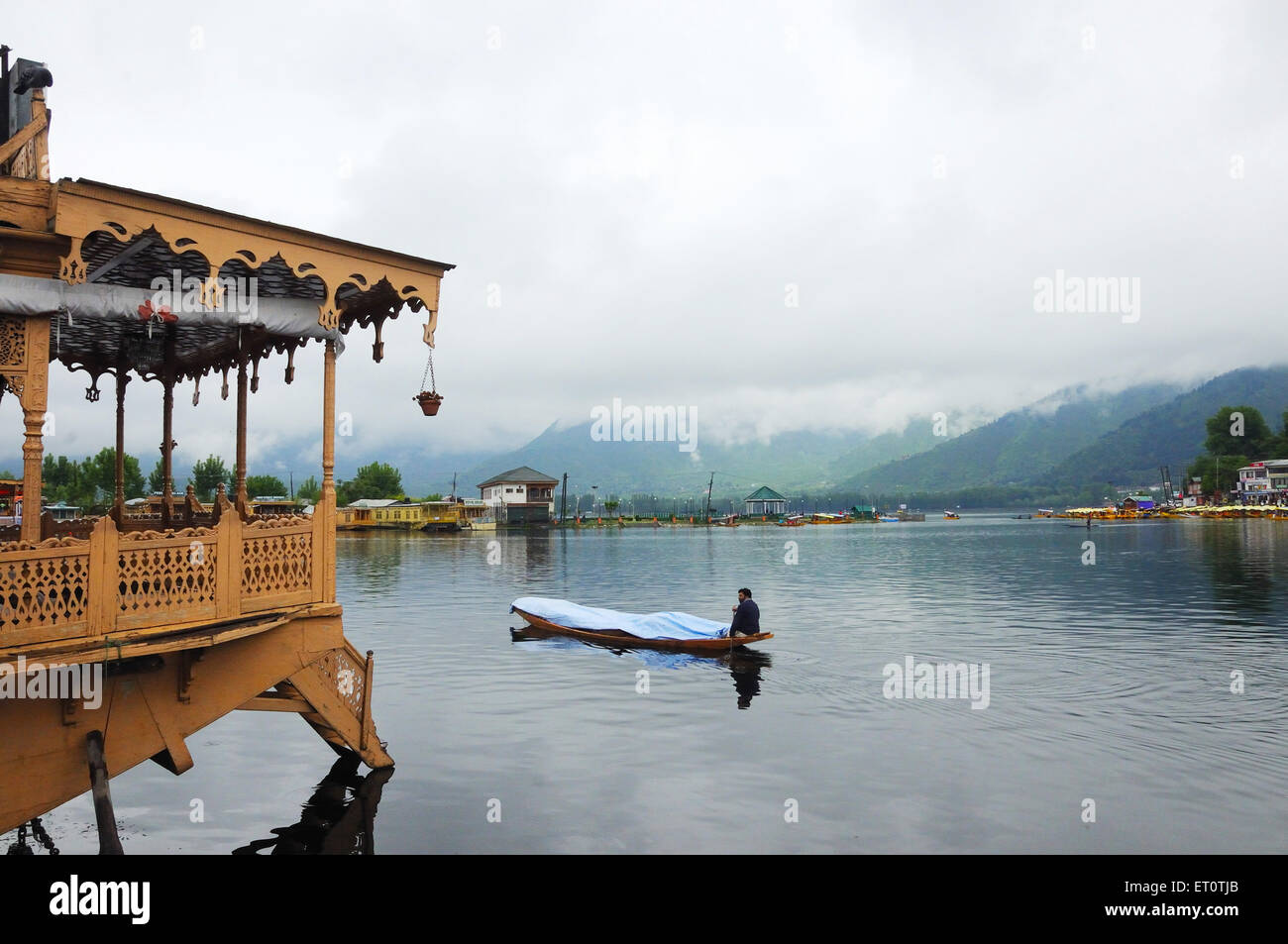 Houseboat and canoe in dal lake ; Srinagar ; Jammu and Kashmir ; India ...