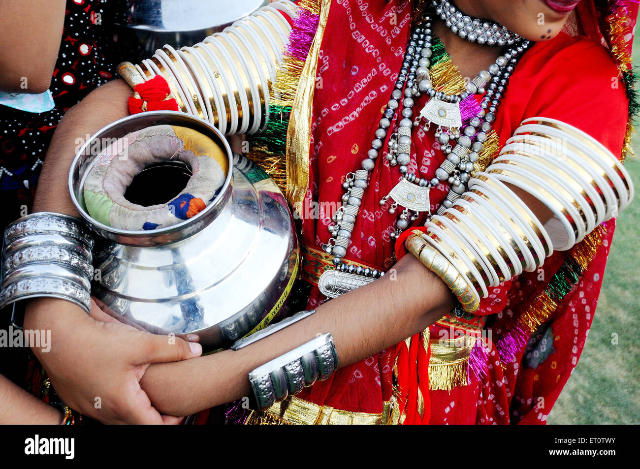 Lady holding pot in hands ; Rajasthan ; India Stock Photo - Alamy