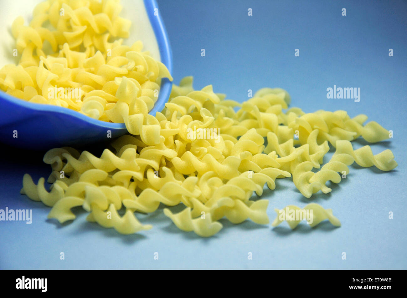 Dried macaroni pasta in bowl India Asia Stock Photo - Alamy
